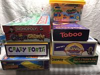 Lot of Board Games Including Monopoly, Taboo, Cranium, and More | Maxsold
