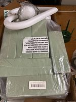 Floral foam, styrofoam, wire, glue gun, candle holders | Maxsold