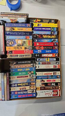 46 movie mixed lot – VHS tapes & DVDs | Maxsold