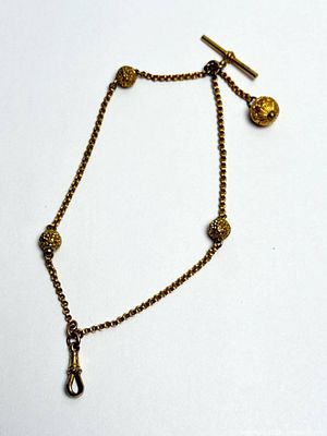 Antique gold watch chain with engraved orbs | Maxsold