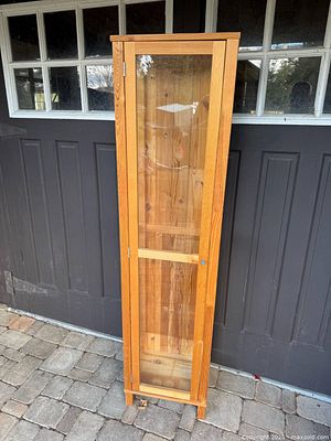 Tall pine display cabinet | Maxsold
