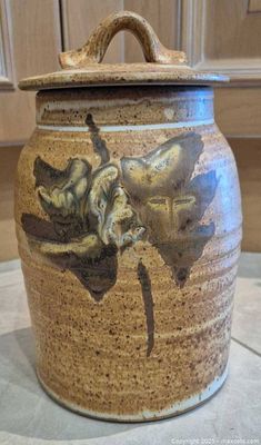 Stoneware speckled brown lidded jar | Maxsold