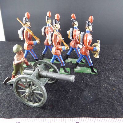 Vintage painted metal toy soldiers with cannon, 8 pcs | Maxsold