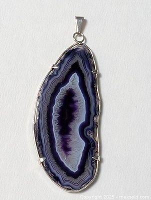 Sterling silver framed polished geode slice pendant | Maxsold