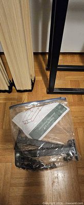 Twin metal bed frame with wood slats | Maxsold