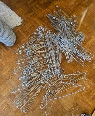 Metal wire clothes hangers bulk lot | Maxsold