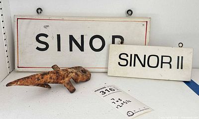 Vintage wooden boat signs and harpoon head | Maxsold