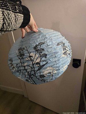 Light blue paper lantern 12 in diameter | Maxsold