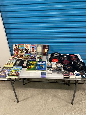 Mixed media: 45 RPM vinyl, cassettes, VHS & DVDs | Maxsold