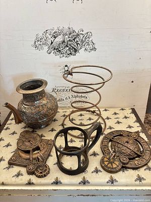 Mixed metal ewer, cup holder, trivets & spring | Maxsold