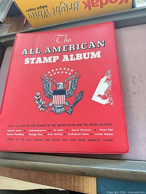 American stamp album with partial U.S. stamp collection | Maxsold
