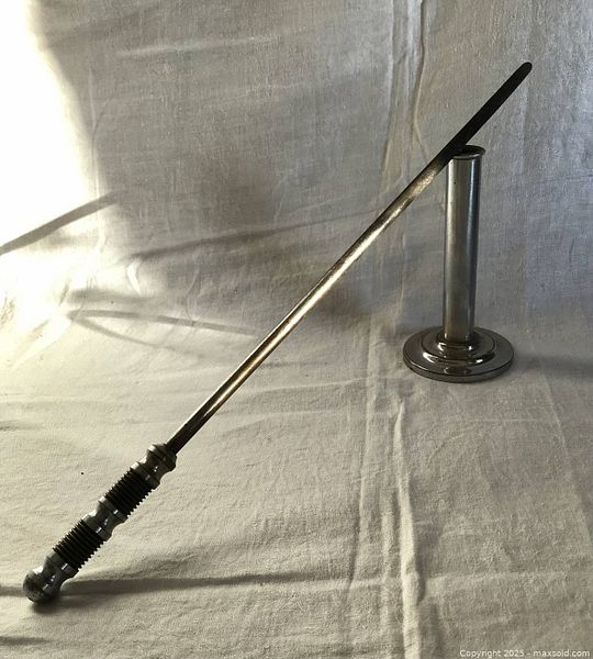 Machine Age steel fireplace poker with stand | Maxsold