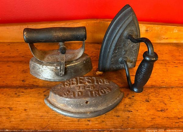 2 antique cast iron sad irons | Maxsold