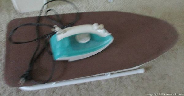 Tabletop ironing board and Rival steam iron | Maxsold