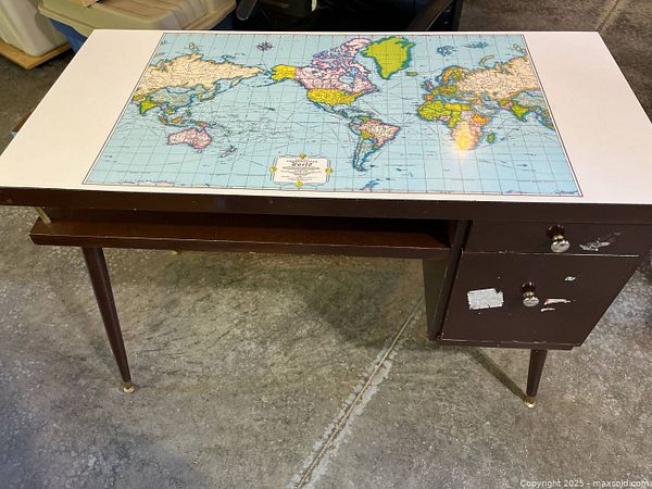 Vintage desk with world map laminate top | Maxsold