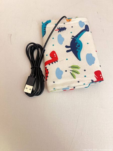 USB-powered heated pad with dinosaur sleeve | Maxsold
