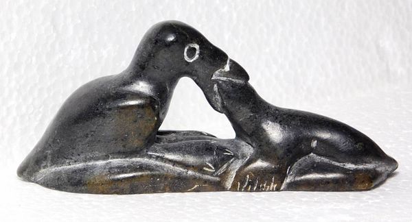Inuit soapstone carving giant bird eating seal | Maxsold