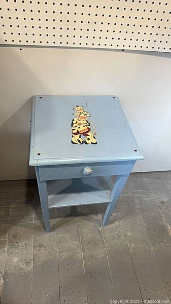 Cow motif blue painted wooden nightstand | Maxsold