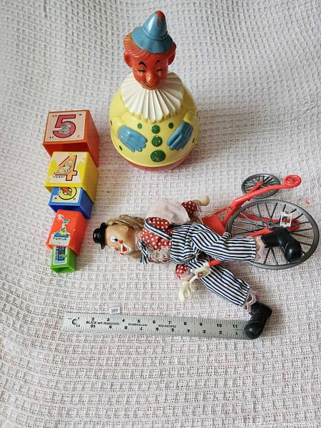 Vintage plastic clowns and jingle-bell stacking blocks | Maxsold