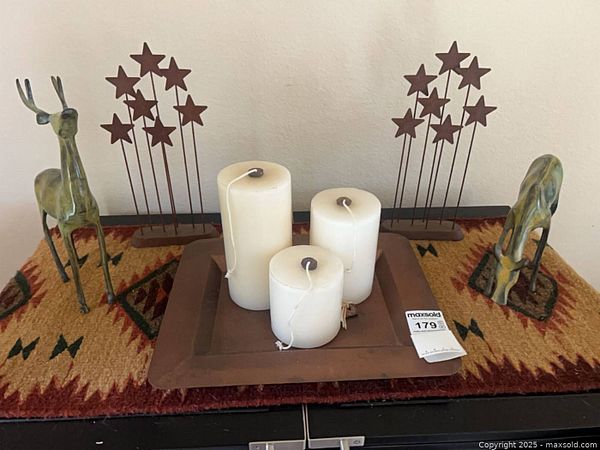 Metal star sprays, deer figurines, candles, woven mat | Maxsold