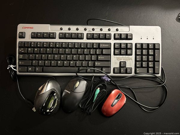 Compaq keyboard with three mice | Maxsold