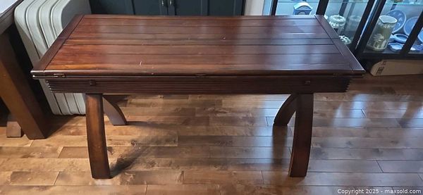Solid wood hinged-top folding dining table | Maxsold