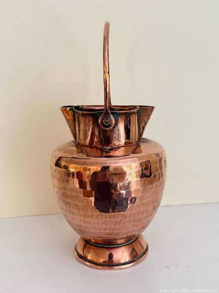 Antique hammered copper double-spout pitcher | Maxsold