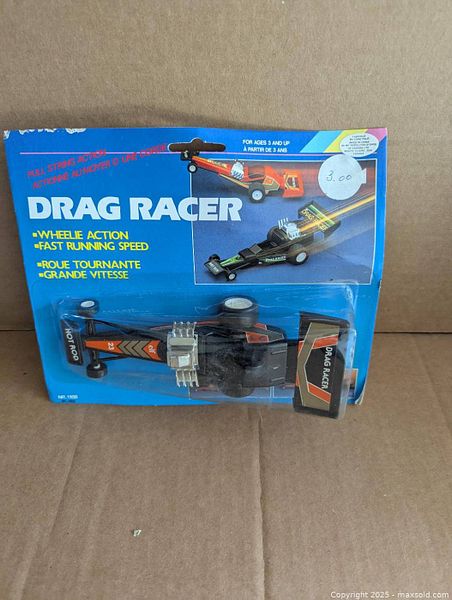 Vintage pull-back drag racer car on card | Maxsold