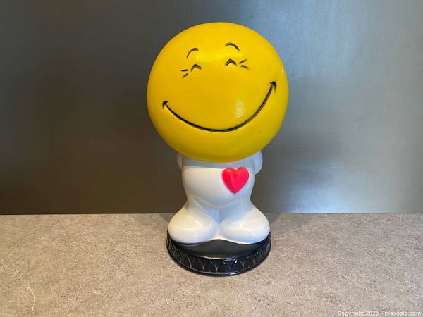 1971 Play Pal Plastics Smiley Face Coin Bank | Maxsold