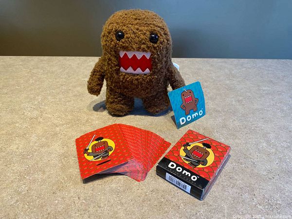 Domo plush with tagged deck of playing cards | Maxsold