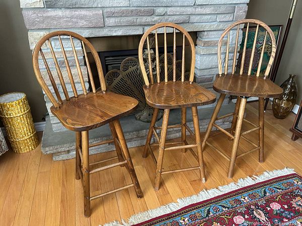 Three Oak Swivel Spindle-Back Bar Stools | Maxsold
