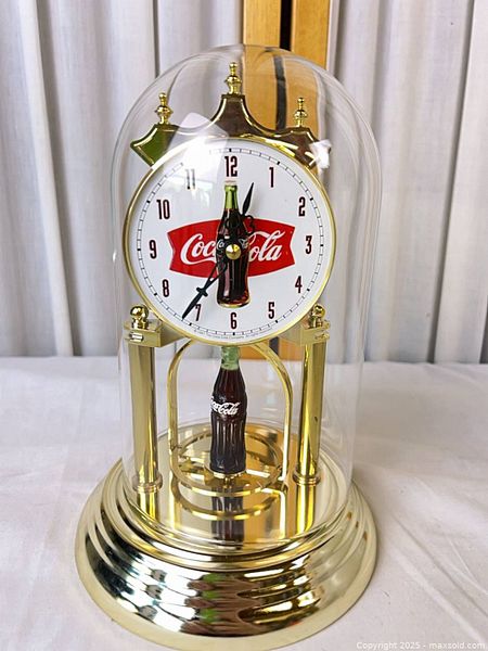 Vintage Coca-Cola rotating anniversary clock | Maxsold