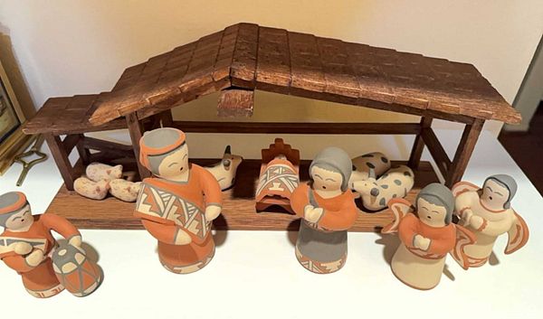 Indigenous hand-crafted clay nativity with wood stable | Maxsold