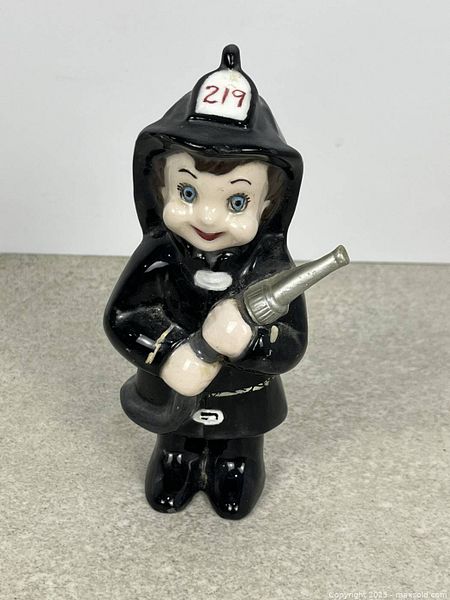 Vintage signed ceramic firefighter boy figurine | Maxsold