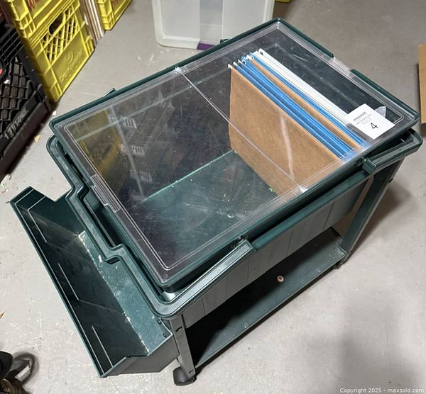 Rolling plastic filing cabinet with folders | Maxsold