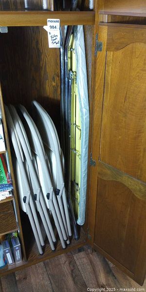 6 Folding Chairs, Ironing Board, Iron, Wooden Storage Cabinet | Maxsold
