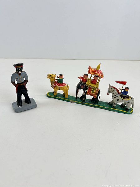 Vintage hand-painted officer figure and animal parade toy | Maxsold