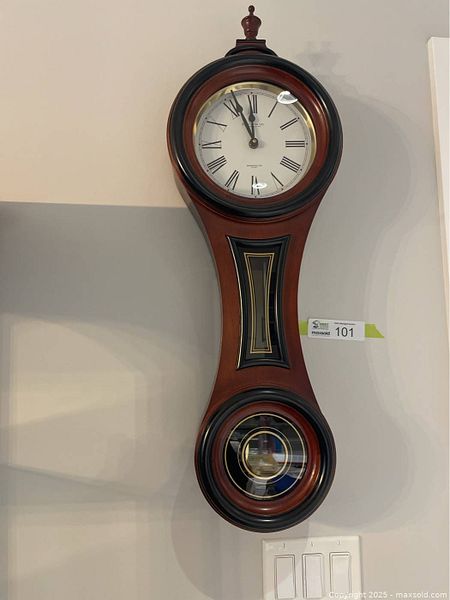 Figure 8 wall clock, wood and glass | Maxsold