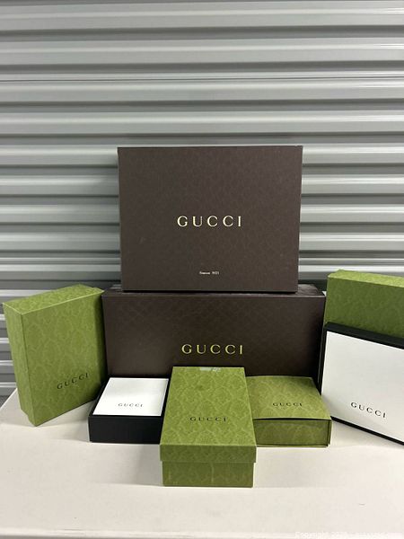 Assorted Gucci empty packaging boxes | Maxsold