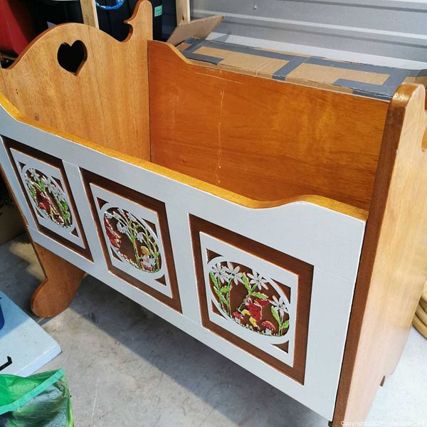 Vintage wooden cradle with painted panels | Maxsold