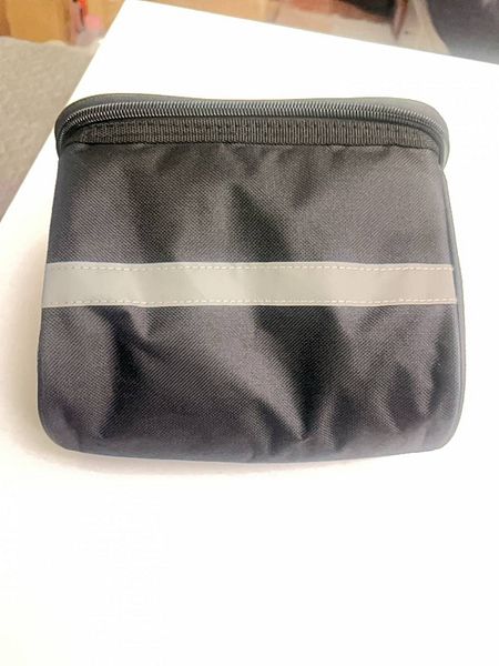 Small black insulated zipper bag, reflective trim | Maxsold