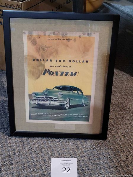 Framed vintage Pontiac advertisement poster | Maxsold