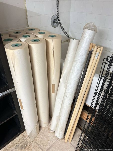 Large Off-White Paper Rolls With Green Plastic Cores | Maxsold