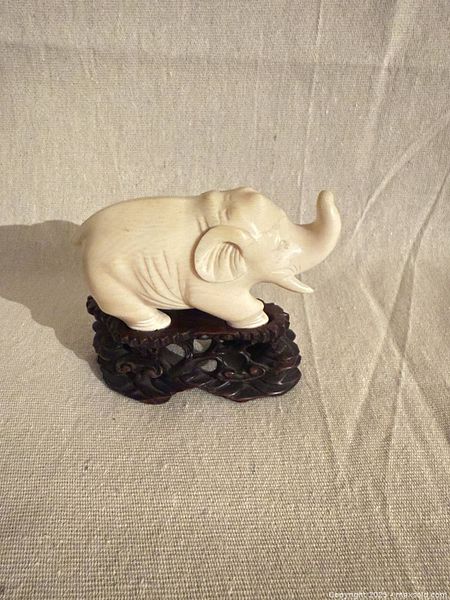 Chinese bone carved elephant figurine & stand | Maxsold