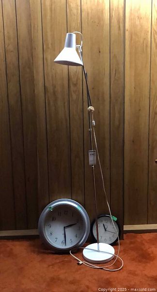 Adjustable floor lamp and two wall clocks | Maxsold