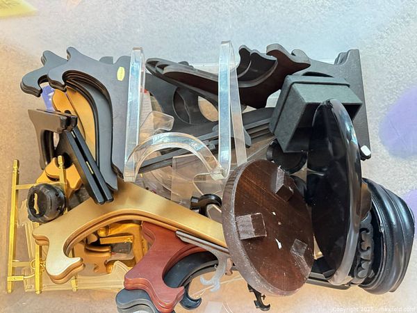 Assorted display stands and plate hangers | Maxsold