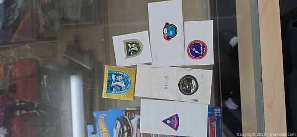 Vintage NASA Apollo 11 matchbook and mission stickers | Maxsold