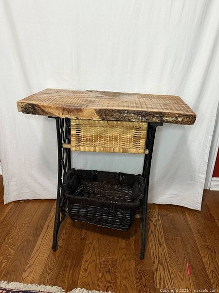 Repurposed Singer treadle base table with live-edge top and two wicker ...