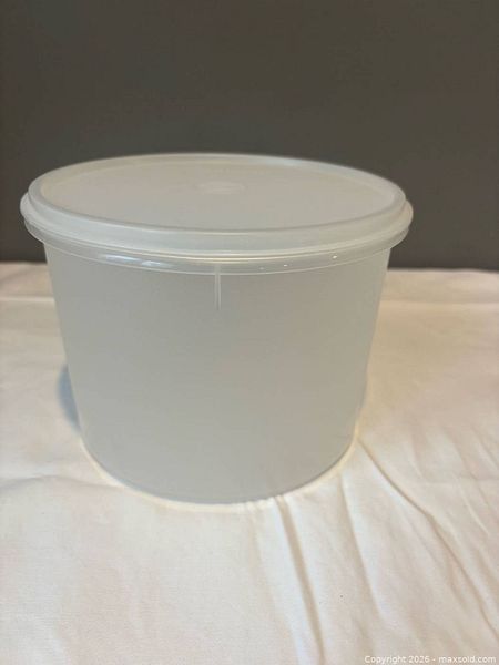 Frosted Tupperware plastic cylinder container with lid | Maxsold