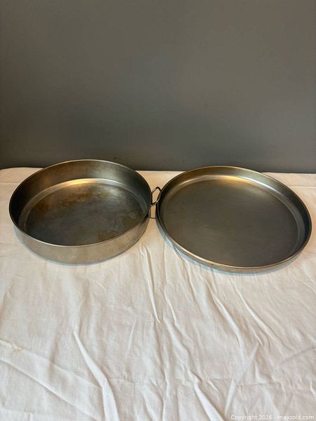 Two round steel cooking pans 11.5" & 13" | Maxsold